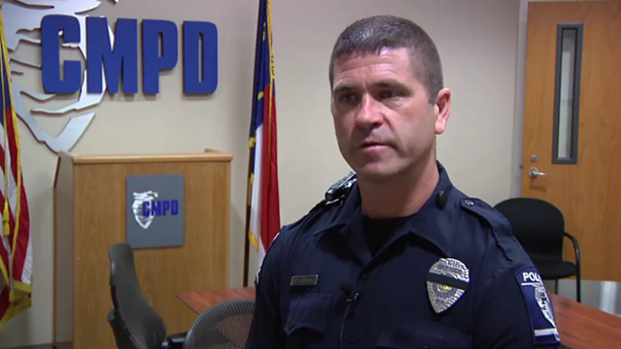 Video: Photo of Charlotte Officer Calming Student Goes Viral | Officer