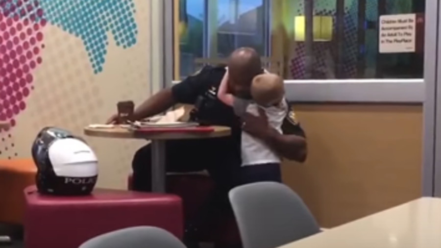 Young Boy Surprises Police Officer With a Hug | Officer