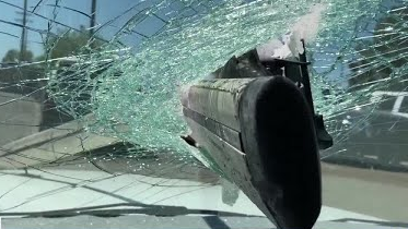 Metal Rod Pierces Moving Ariz. Police Car's Window, Misses Officer ...