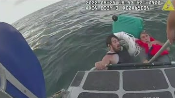 Watch Boston Police Rescue Dad, Son from Harbor after Boat Sank | Officer