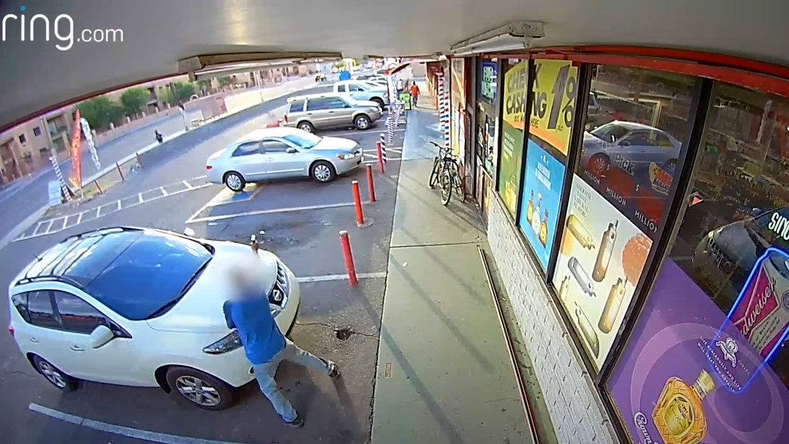 Watch Phoenix Police Take Down Armed Man Outside Strip Mall | Officer